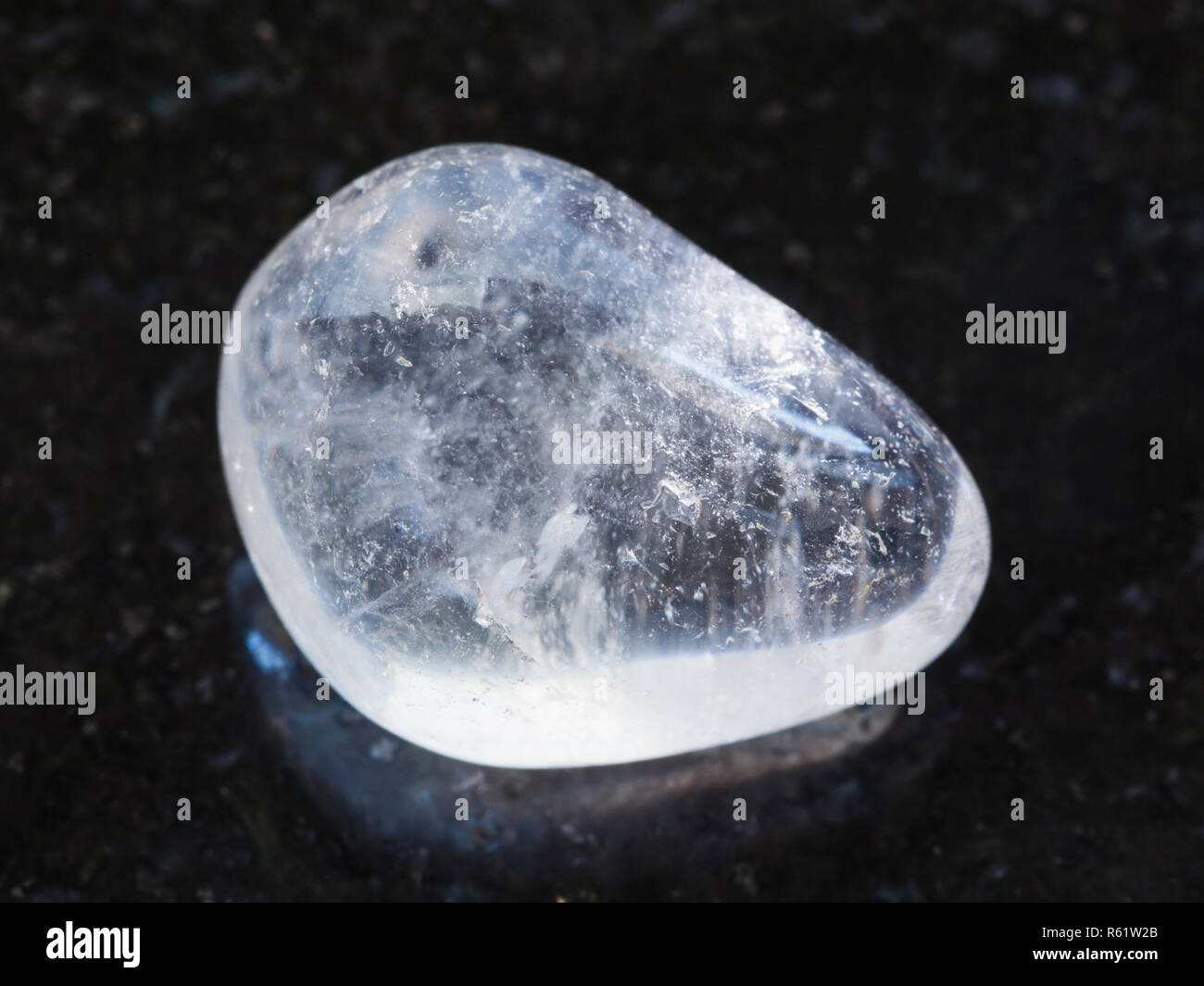 tumbled Rock-crystal gemstone on dark background Stock Photo - Alamy