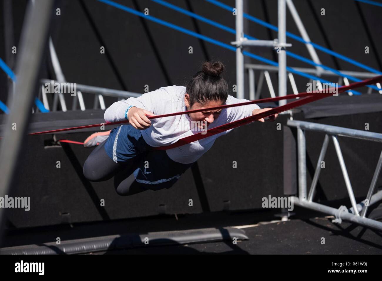 U.S. Air Force Airmen compete in a 32-obstacle course during the Alpha ...