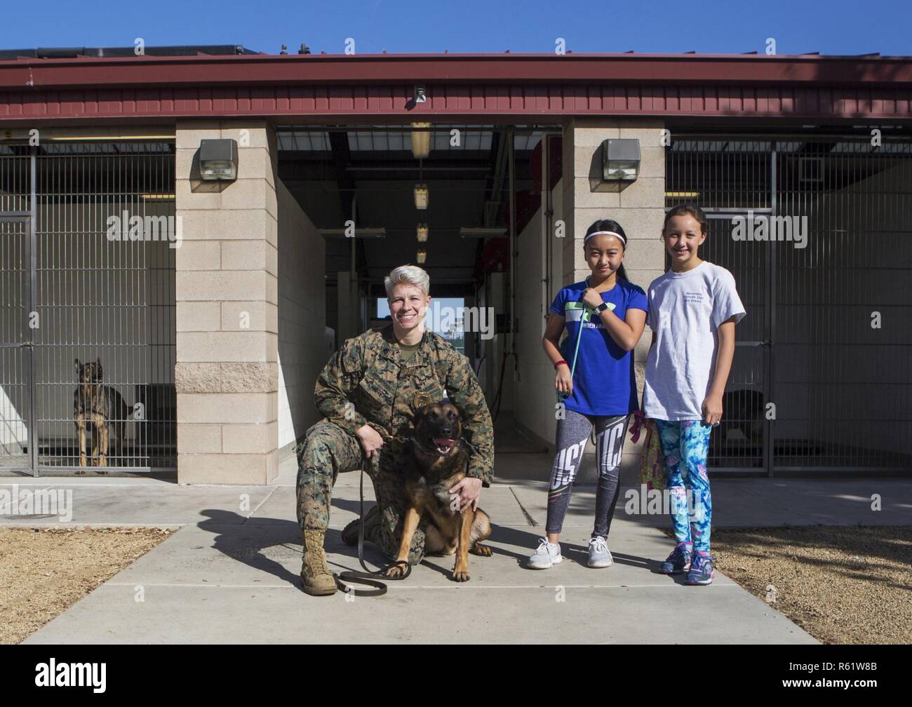 U.S. Marine Corps Sgt. Kaitlyn J. Fishbough, a military working dog ...