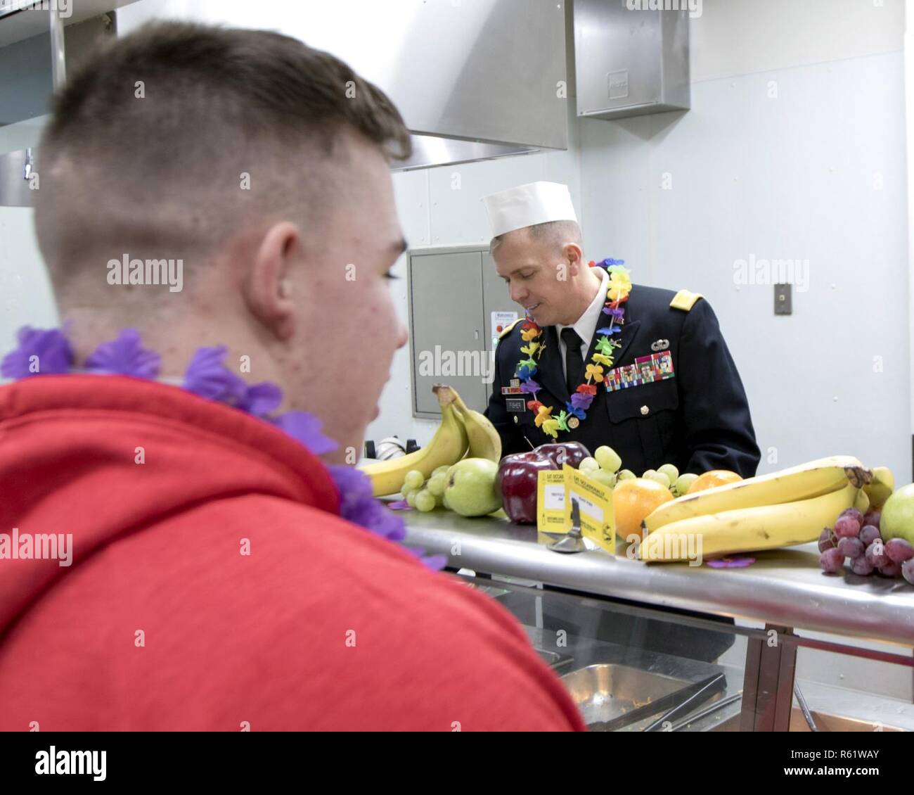 Col. Sean Fisher (right), Fort Wainwright garrison commander, serve a ...
