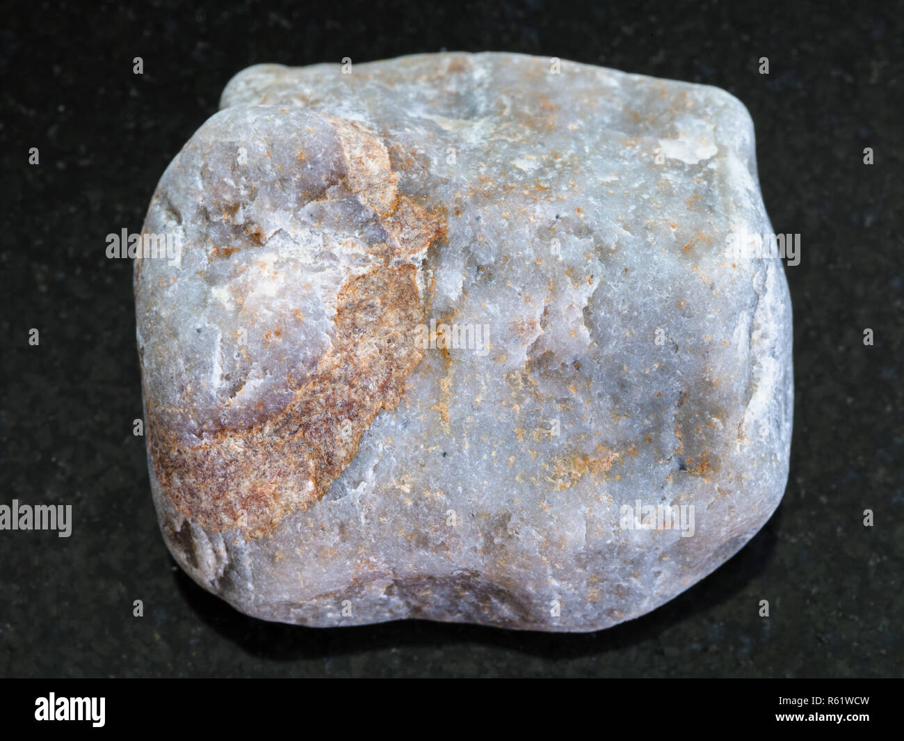 pebble of green marble stone on dark background Stock Photo - Alamy