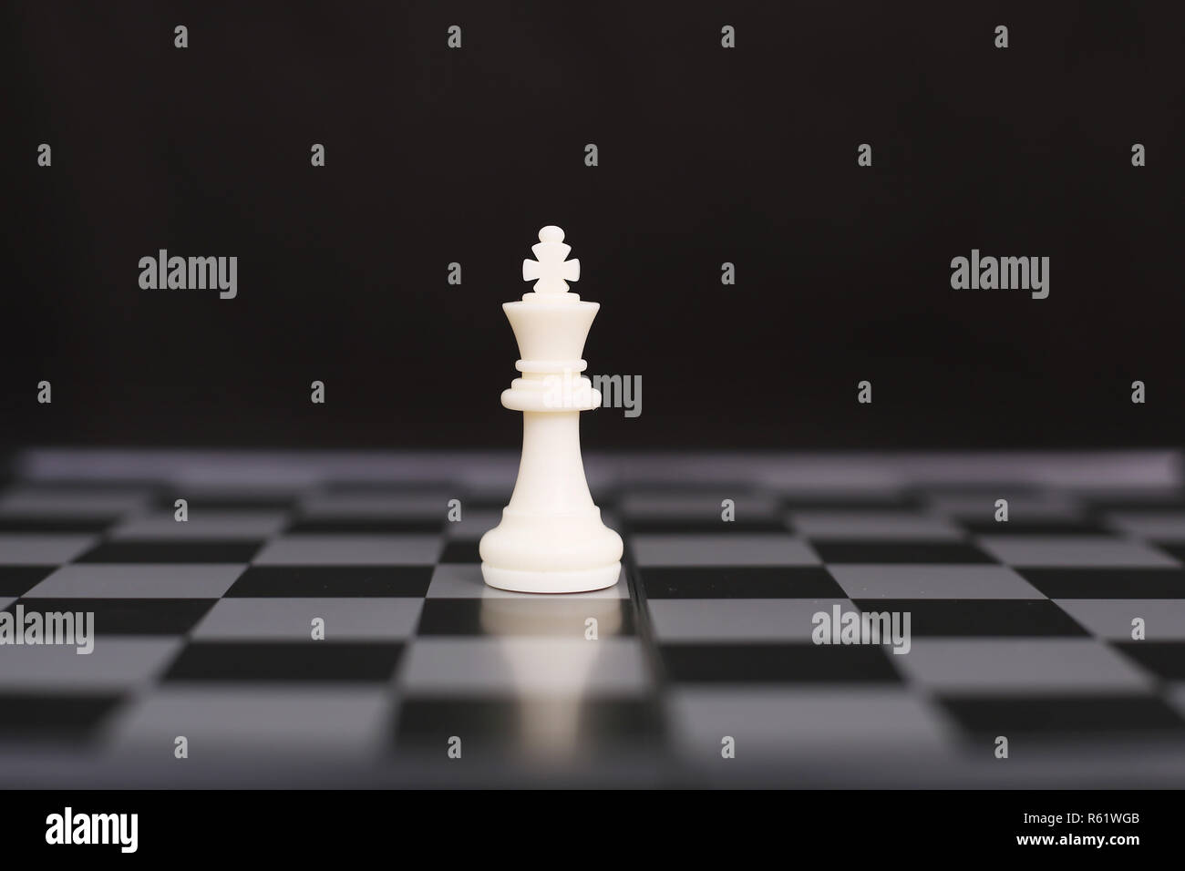 Chess pawn on the chess board. isolated on the black background Stock ...