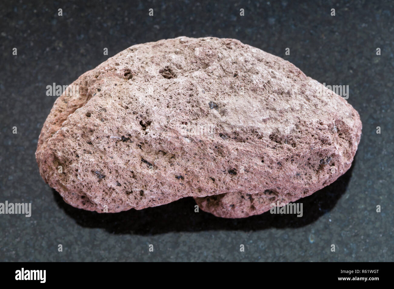 red pumice pebble on dark background Stock Photo - Alamy