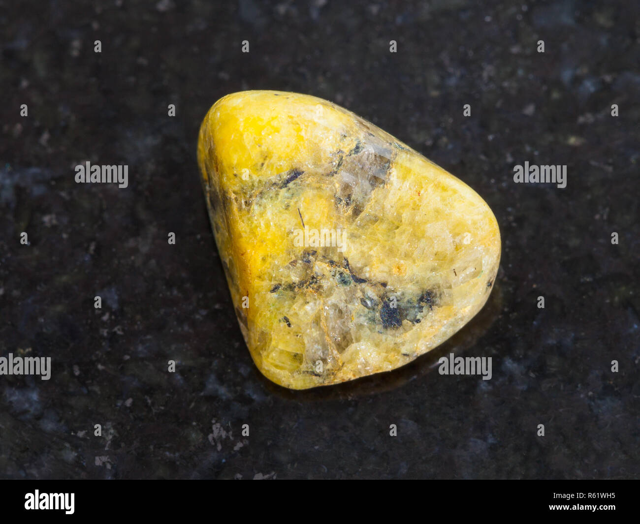 polished yellow Agate gemstone on dark background Stock Photo - Alamy