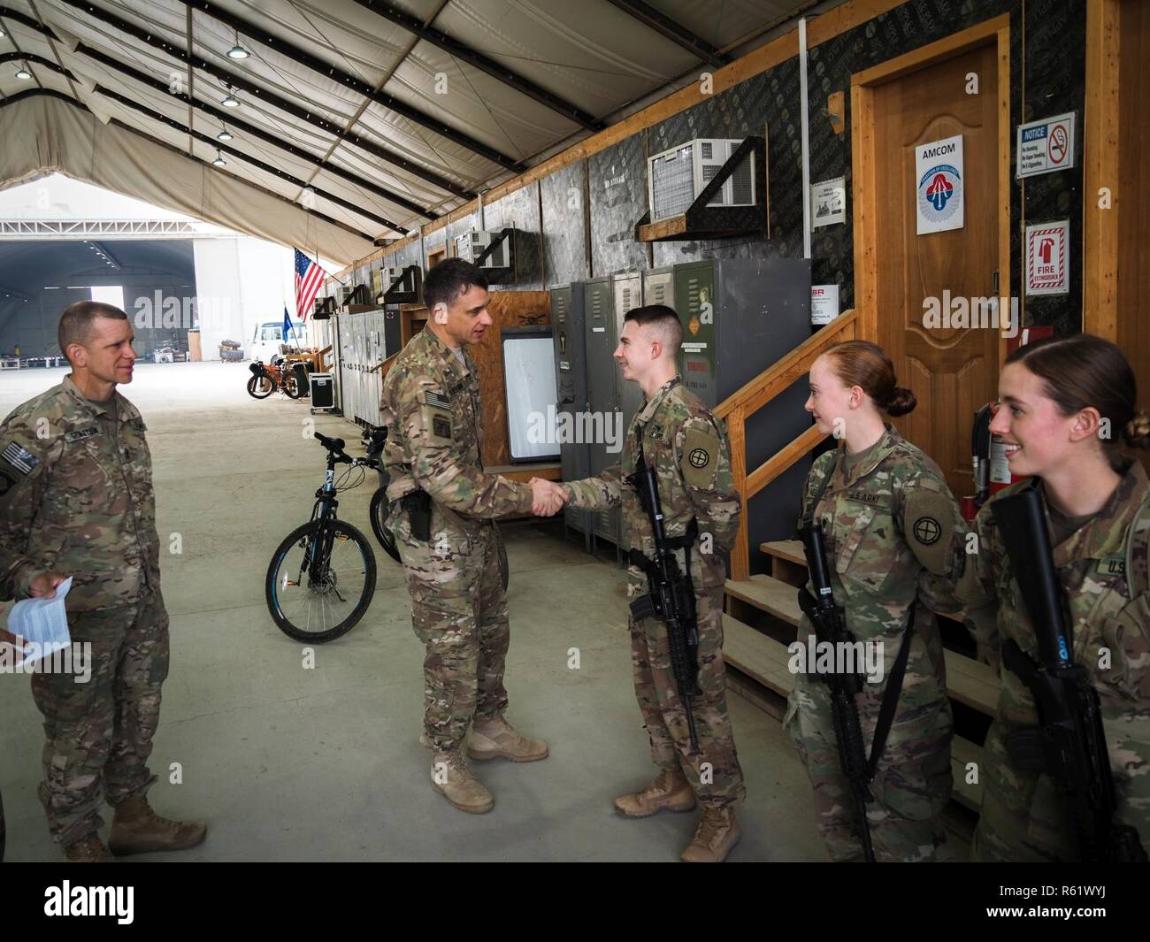 U.S. Army Command Sgt. Maj. Charles Albertson, left center, assigned to ...