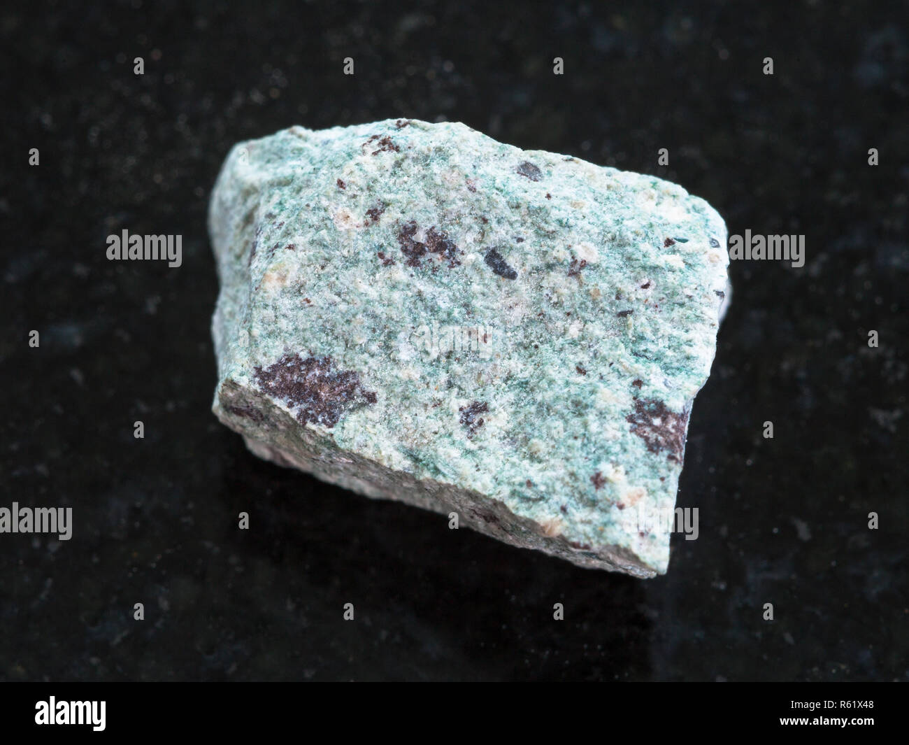 raw Trachyte stone on dark background Stock Photo - Alamy