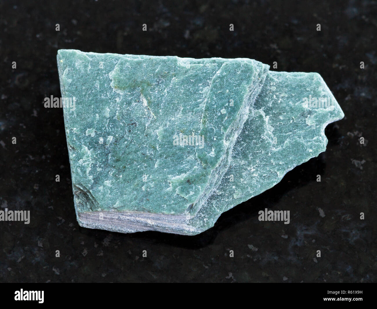 rough Phyllite stone on dark background Stock Photo - Alamy