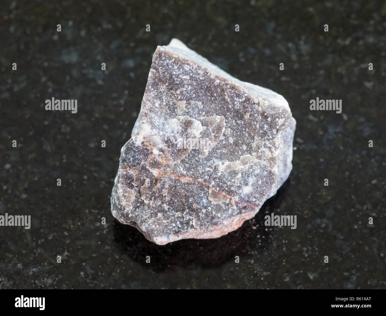 rough Limestone stone on dark background Stock Photo - Alamy