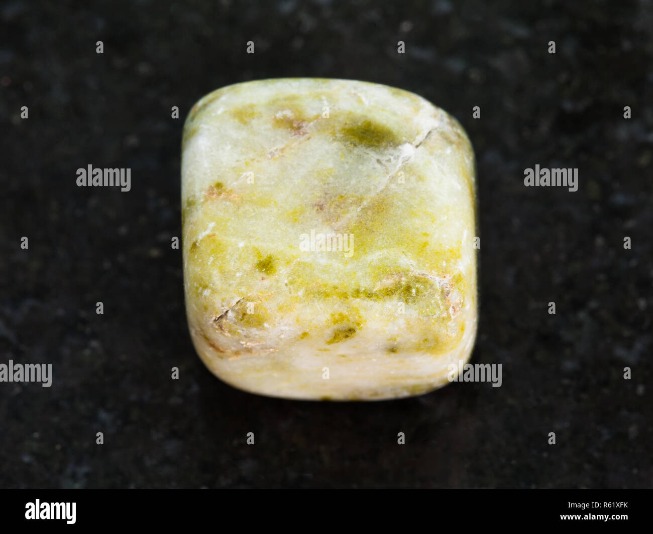polished agate gem stone on dark background Stock Photo - Alamy
