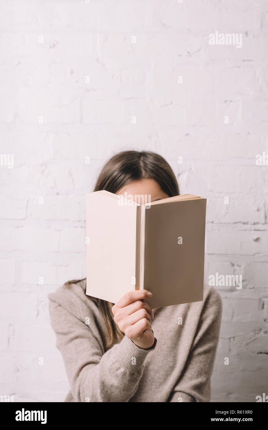 Girl Hiding Face With Book Teenager Hiding Face Behind Book | Free