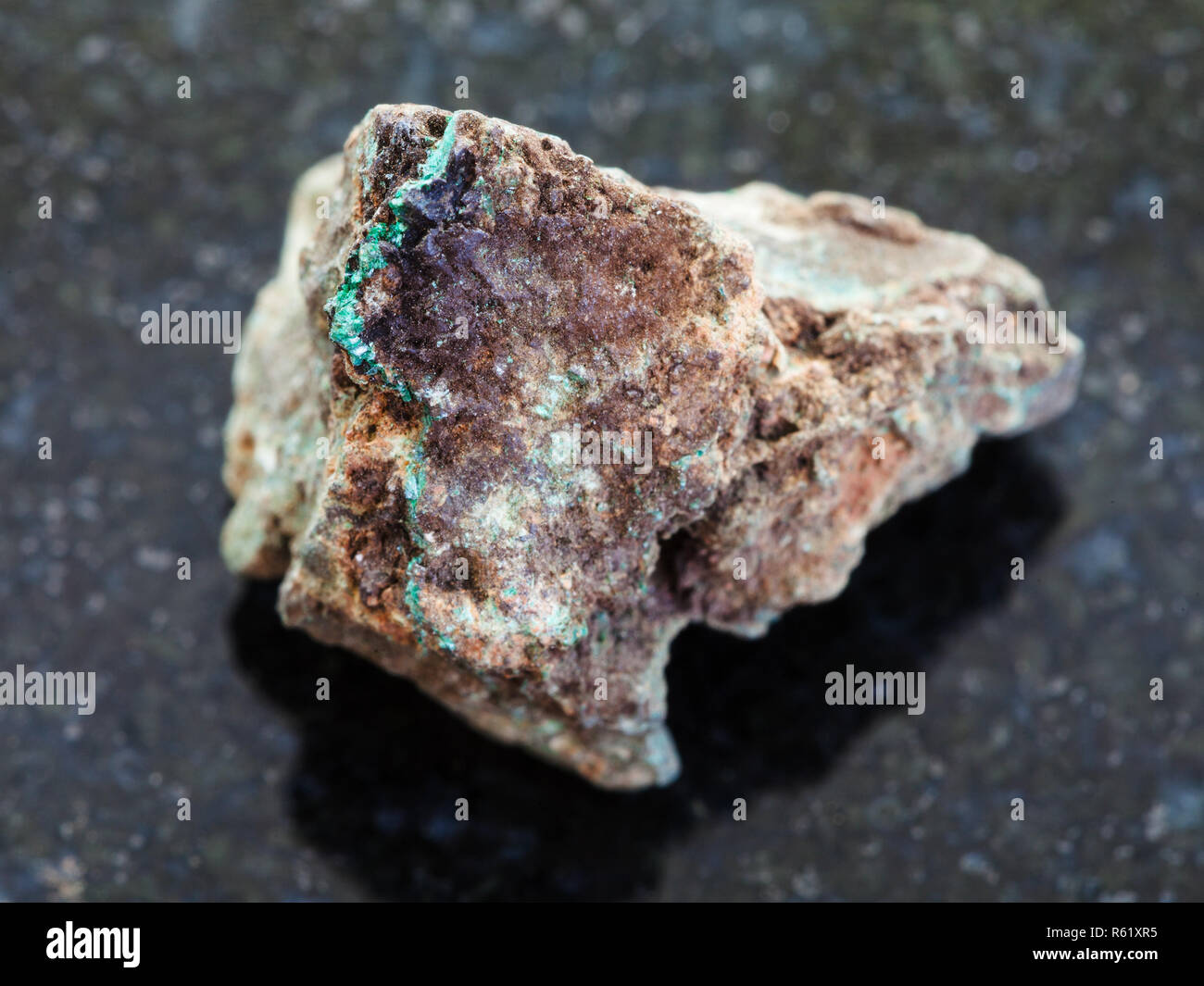 Malachite (copper ore) stone on dark background Stock Photo - Alamy