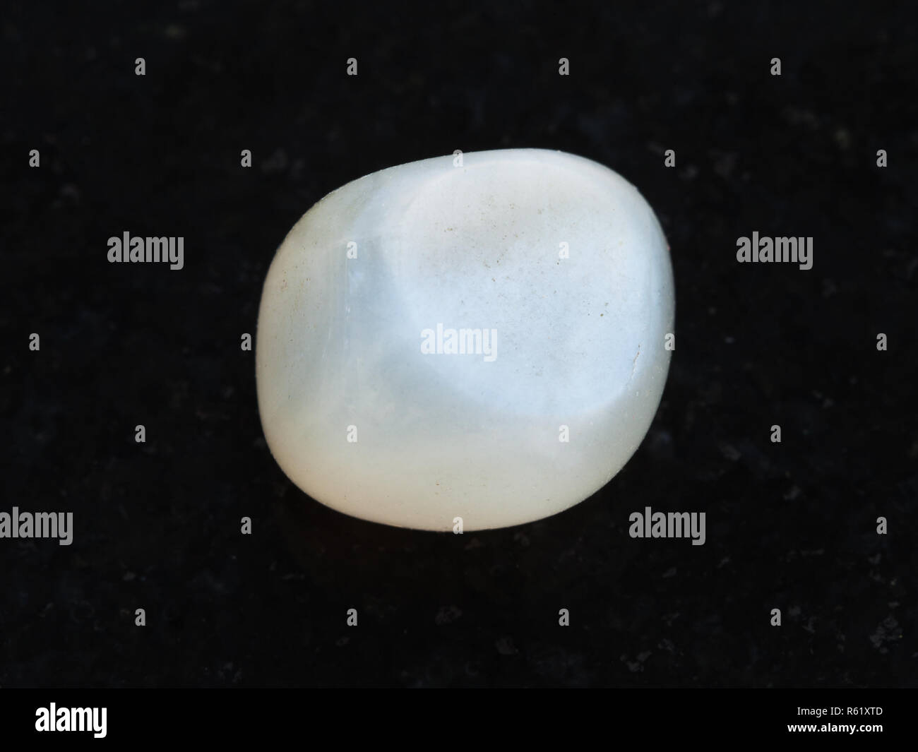 polished translucent moonstone gemstone on dark Stock Photo - Alamy