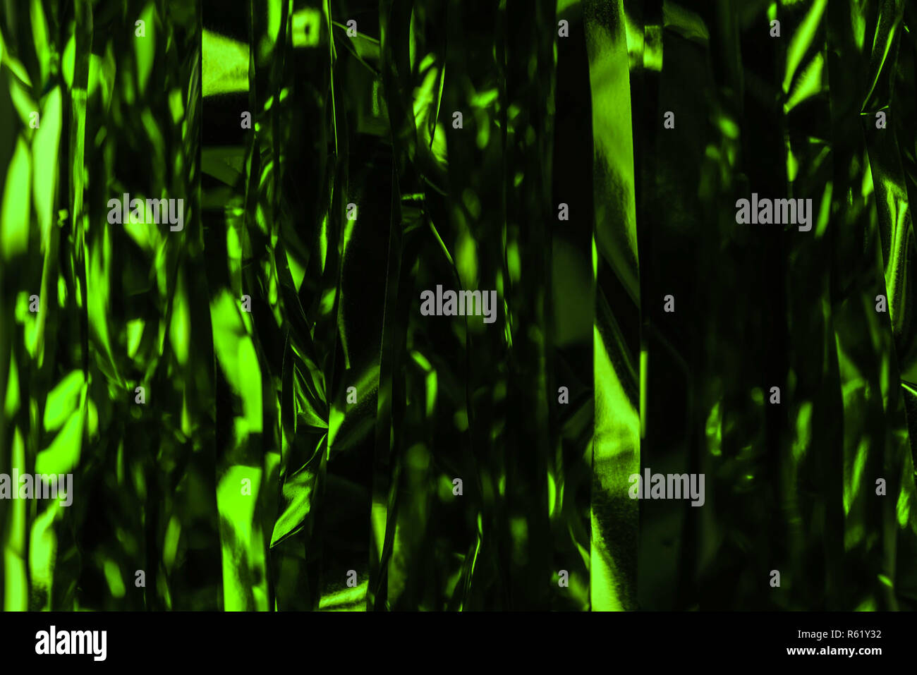 dark green shiny streamers as new year background Stock Photo - Alamy