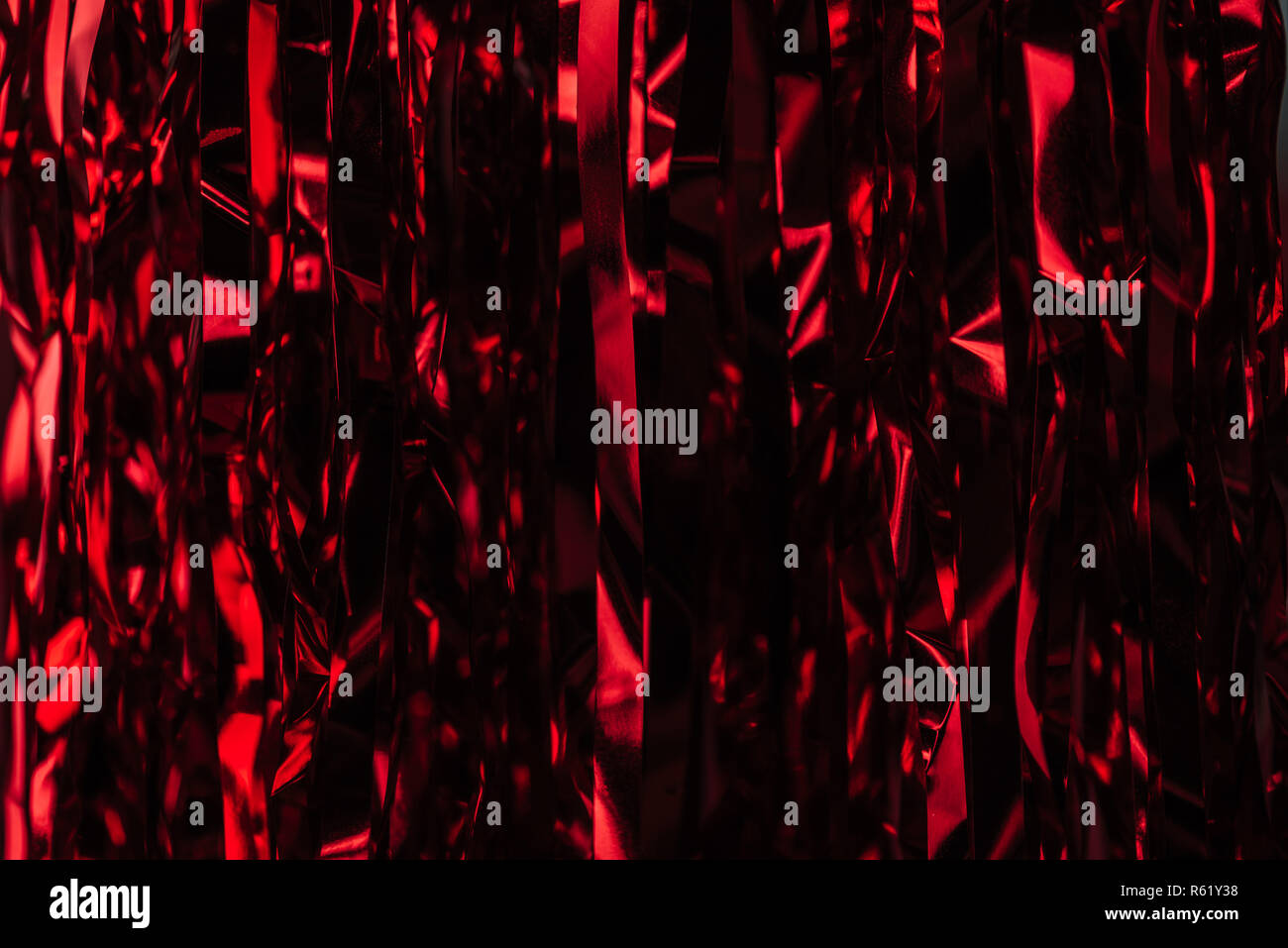 dark red streamers as christmas background Stock Photo - Alamy