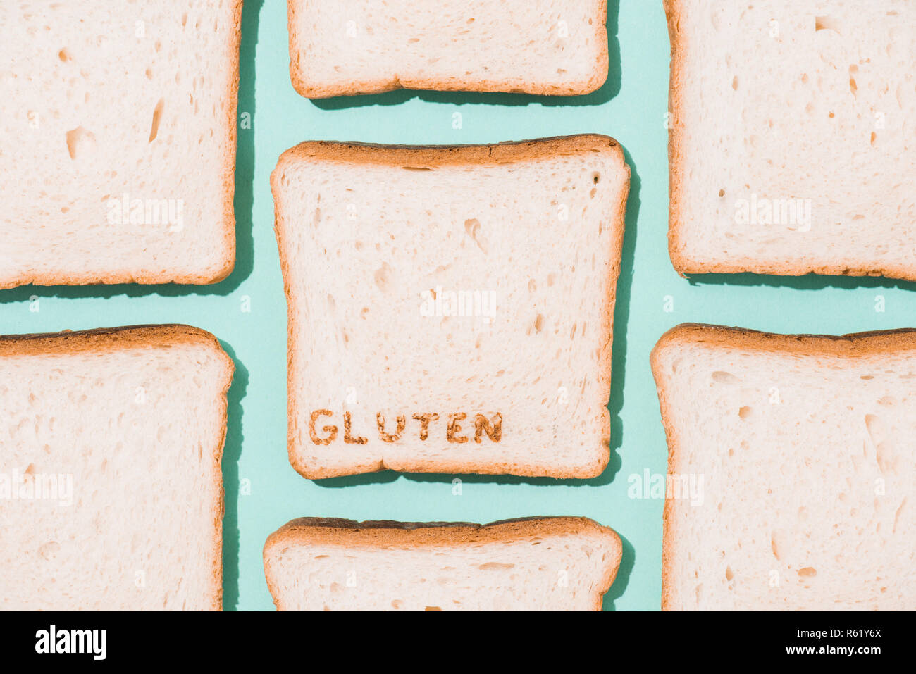 top view of bread slices with gluten sign on blue surface Stock Photo ...