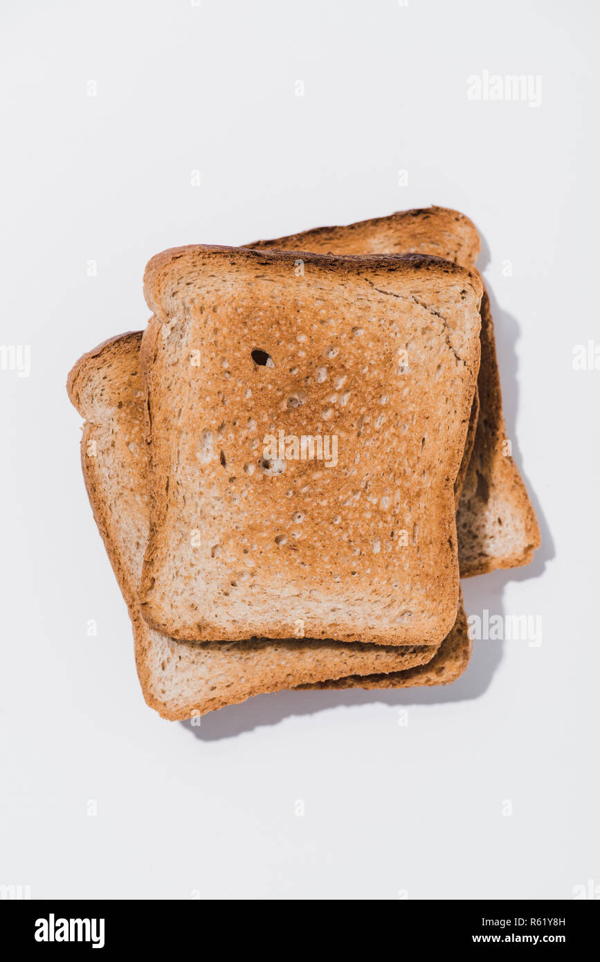 top view of stacked toasts on white surface Stock Photo - Alamy