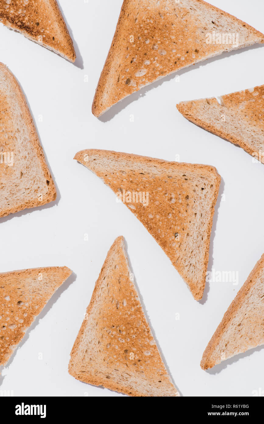 top view of toasts cut in triangles on white surface Stock Photo - Alamy