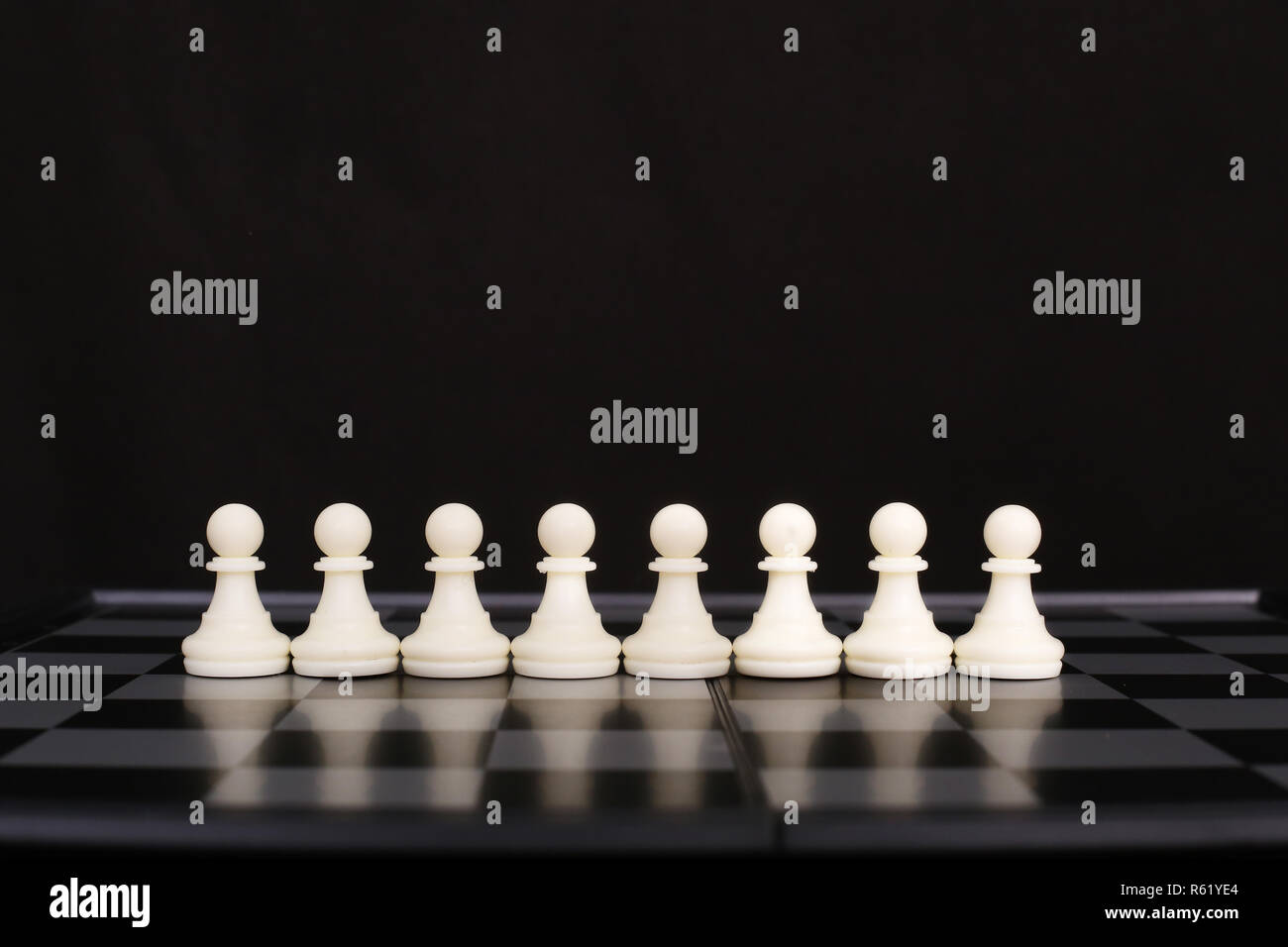 Picture of white chess pawn and chessboard. isolated on the black ...