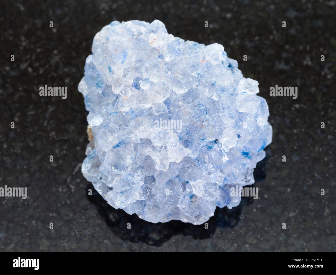 rough celestine stone on dark background Stock Photo - Alamy