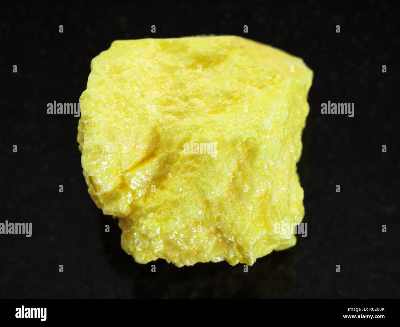 raw native Sulphur stone on dark background Stock Photo - Alamy