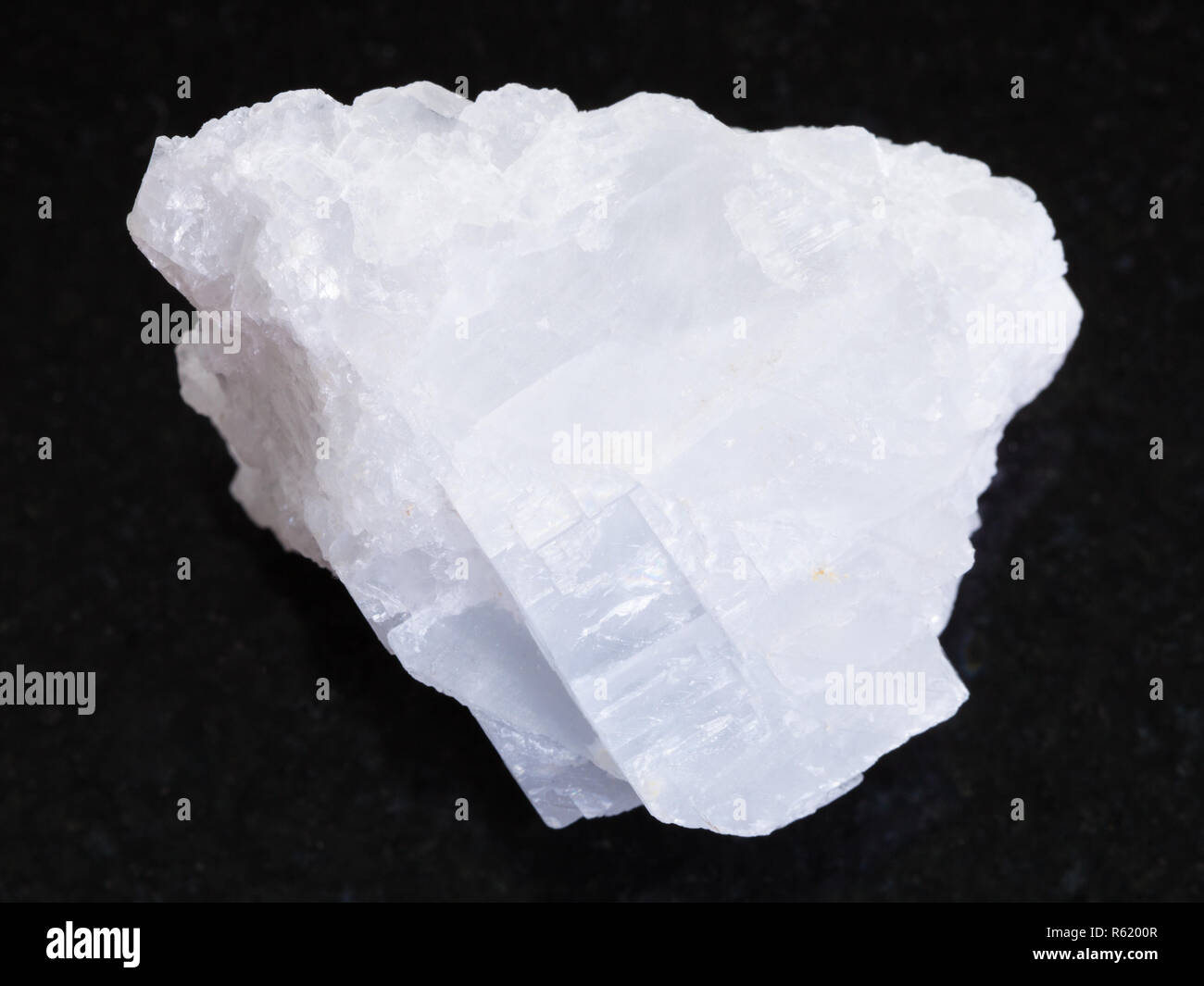 rough crystalline Magnesite stone on dark Stock Photo - Alamy