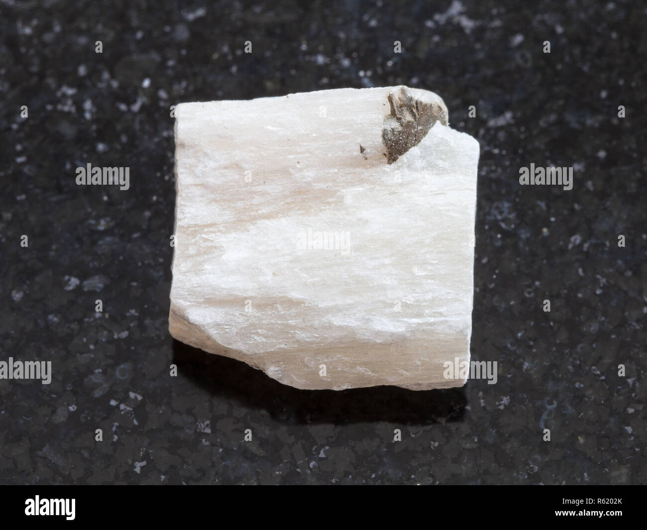 rough Gypsum stone on dark background Stock Photo - Alamy