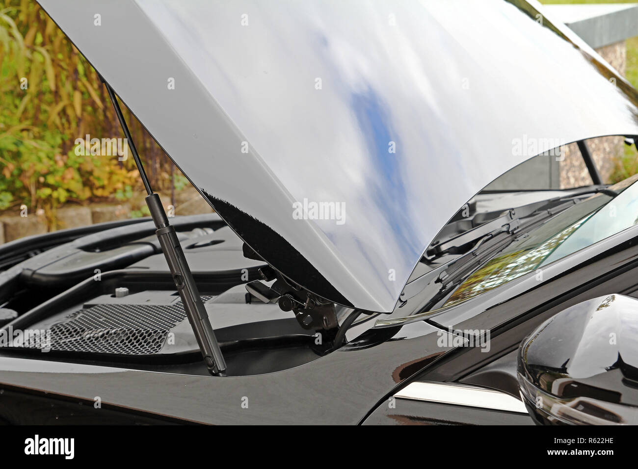 the engine of a black car with open hood. diesel engine in a car Stock ...