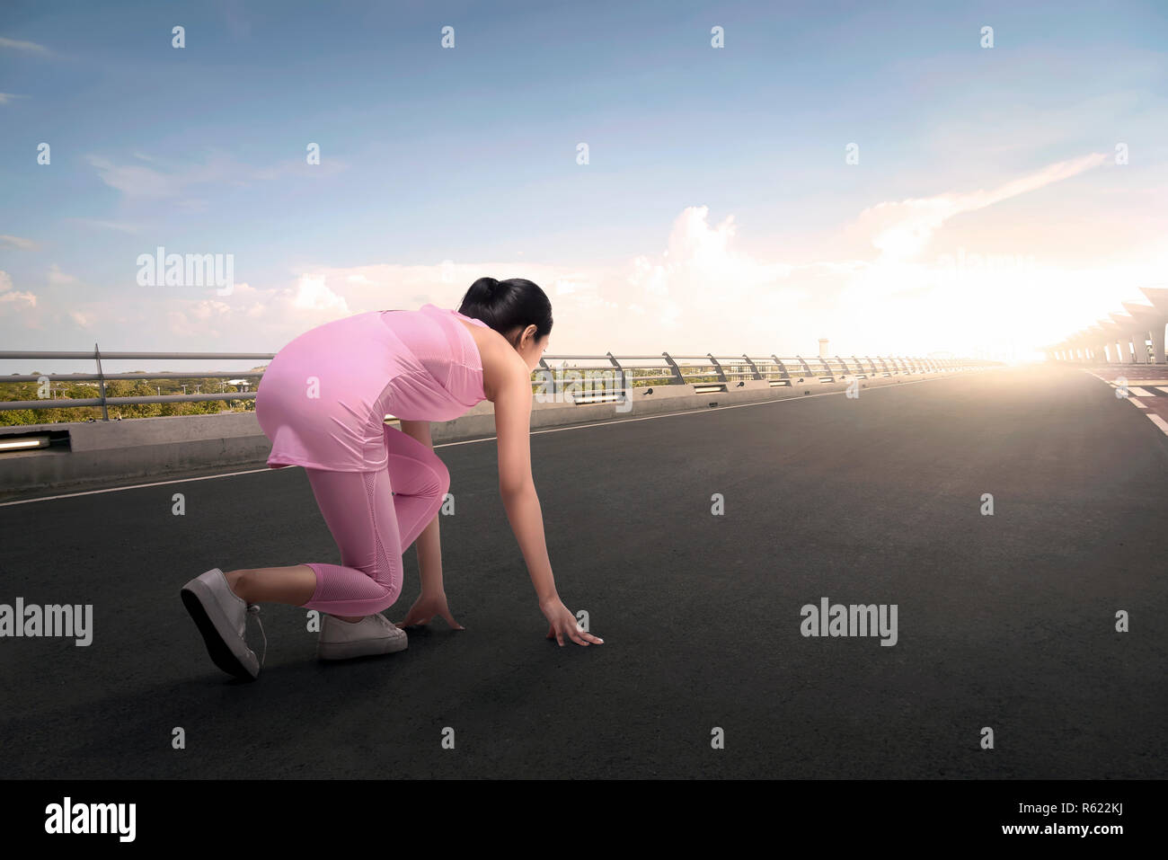 Portrait of asian woman in ready position to running Stock Photo - Alamy