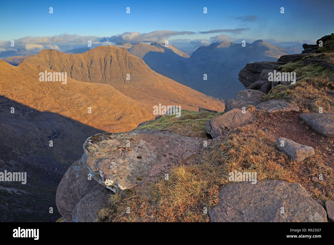 View from the summit of Beinn Alligin over the Torridon Mountains ...