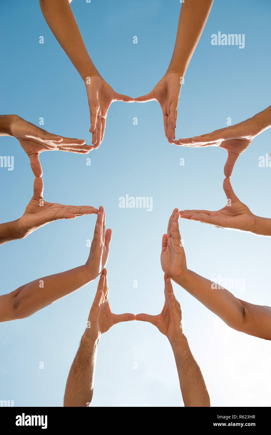 Hands making a Cross Stock Photo - Alamy