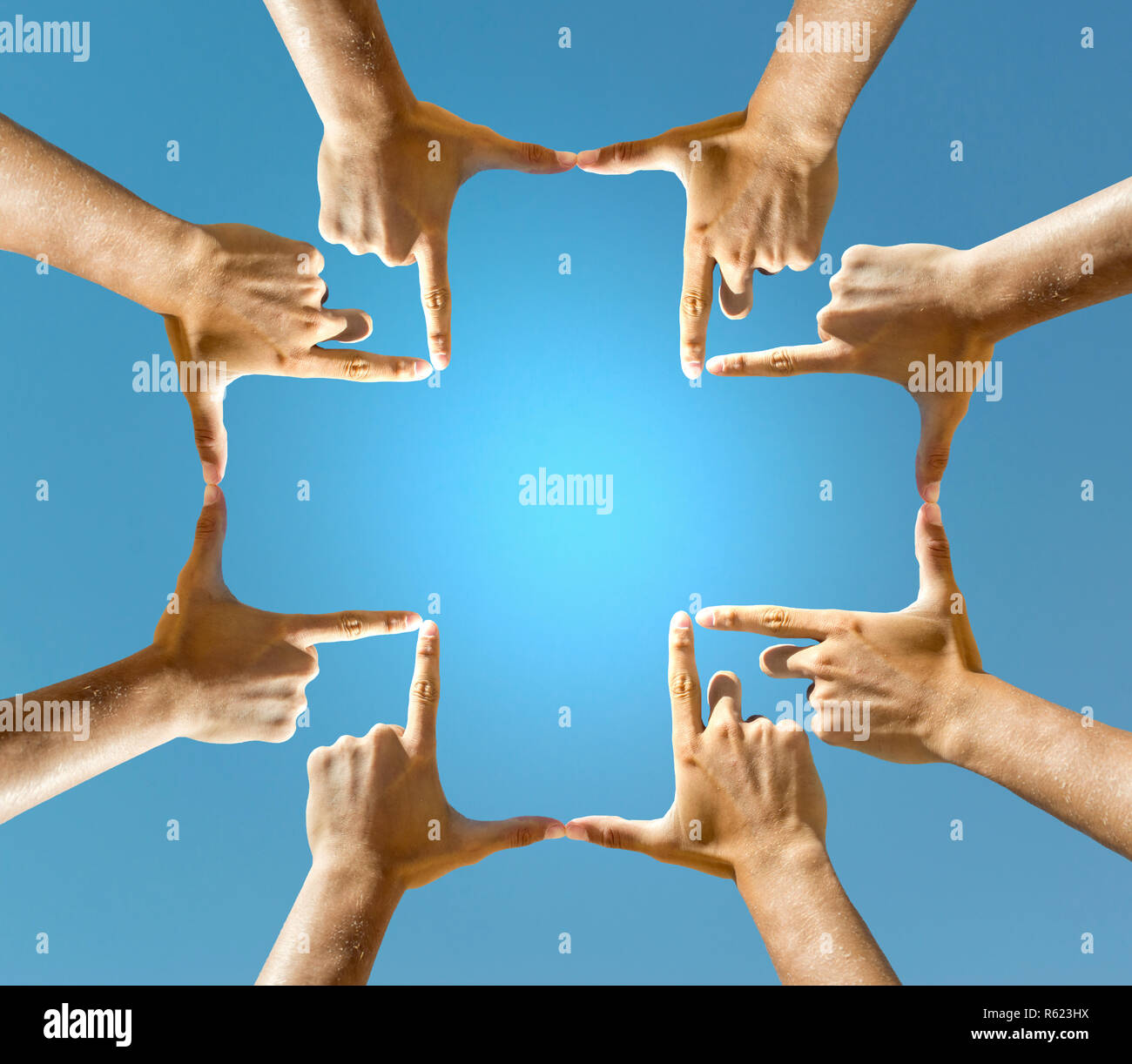 Hands making a Cross Stock Photo - Alamy