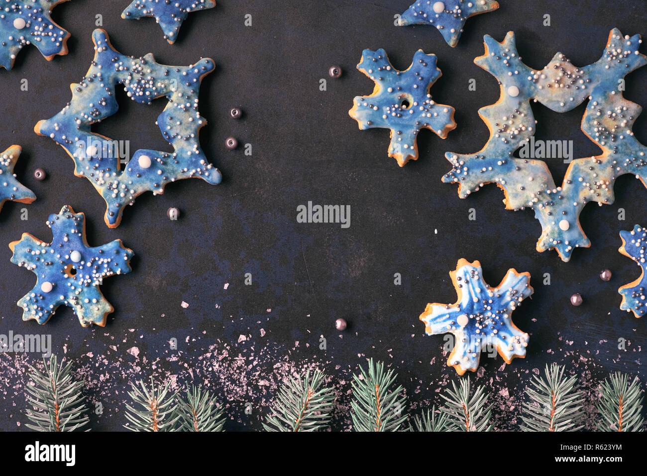 Christmas background, flat lay with snowflake and star cookies on dark ...
