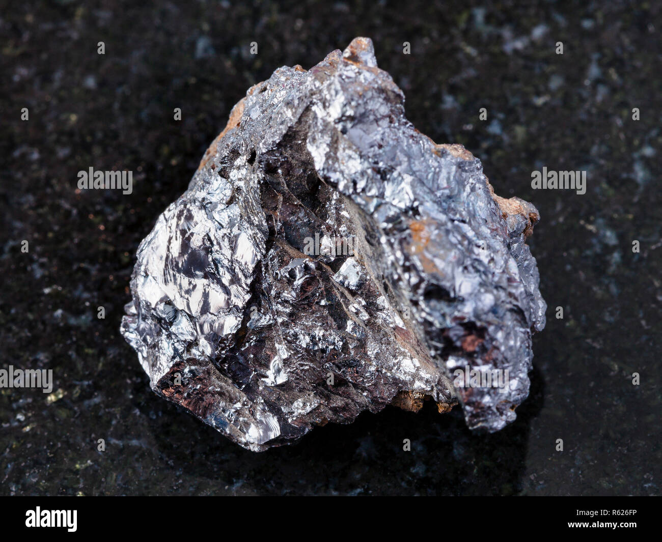 raw ilmenorutile (Nb-bearing rutile) stone on dark Stock Photo - Alamy
