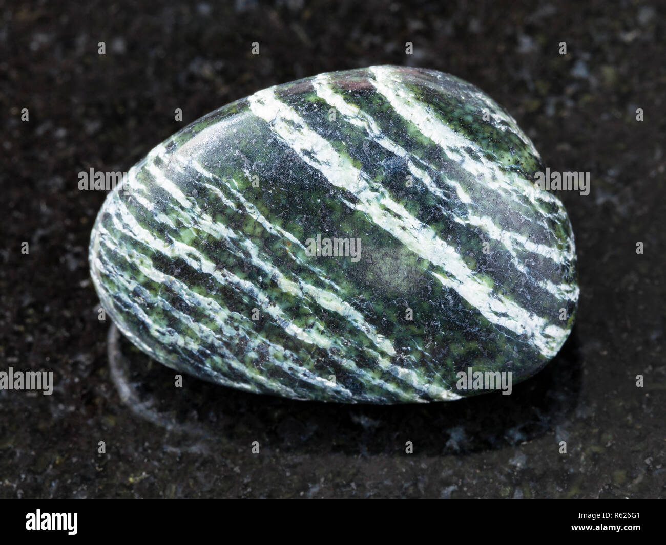 polished Chrysotile asbestos gemstone on dark Stock Photo - Alamy