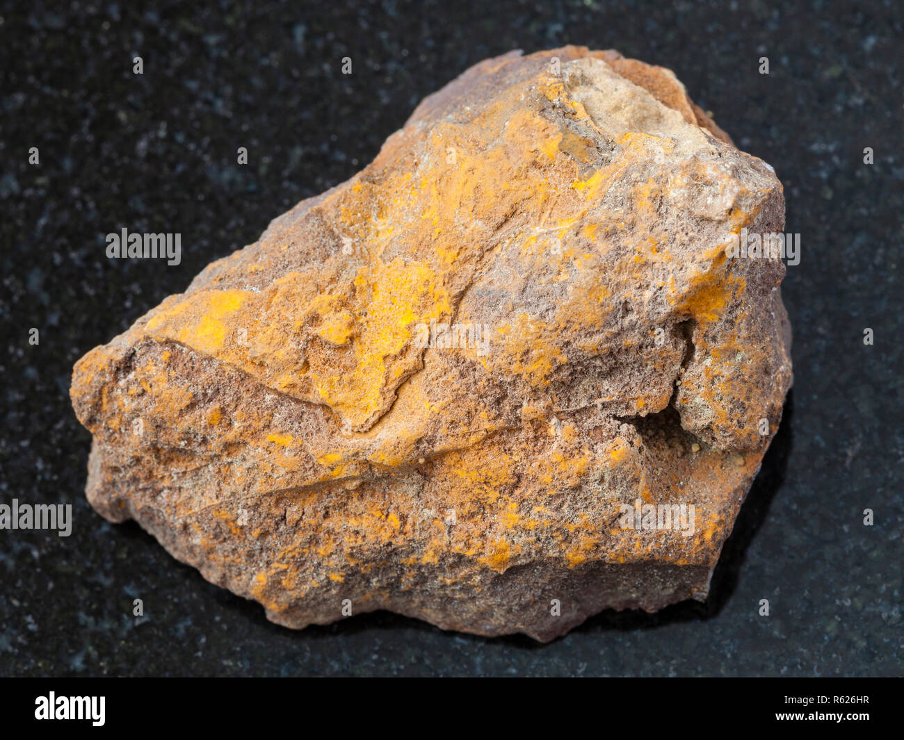 rough limonite stone on dark background Stock Photo - Alamy