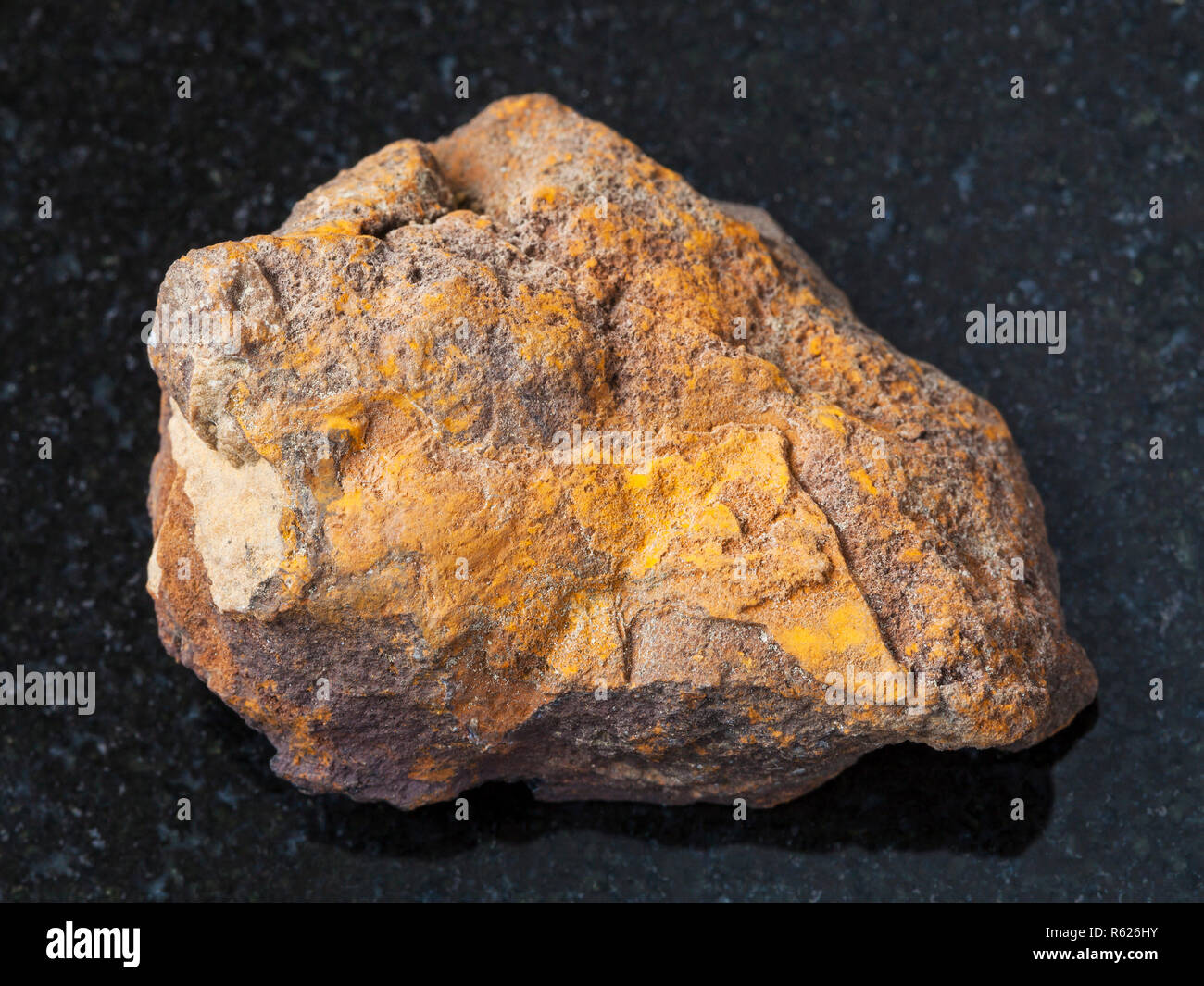 raw limonite stone on dark background Stock Photo - Alamy