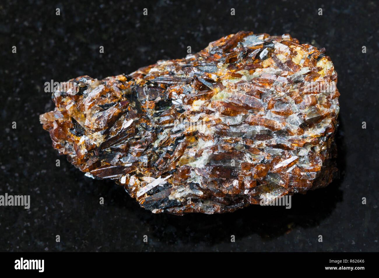 raw Titanite stone on dark background Stock Photo - Alamy