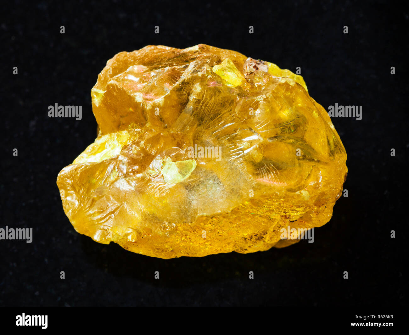 raw crystal of sulphur stone on dark background Stock Photo - Alamy
