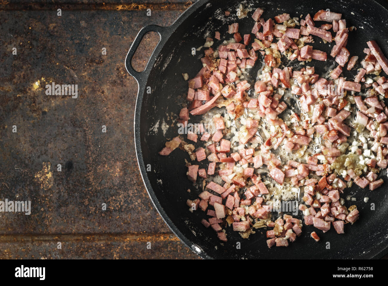 Bacon cooks in frying pan hi-res stock photography and images - Alamy