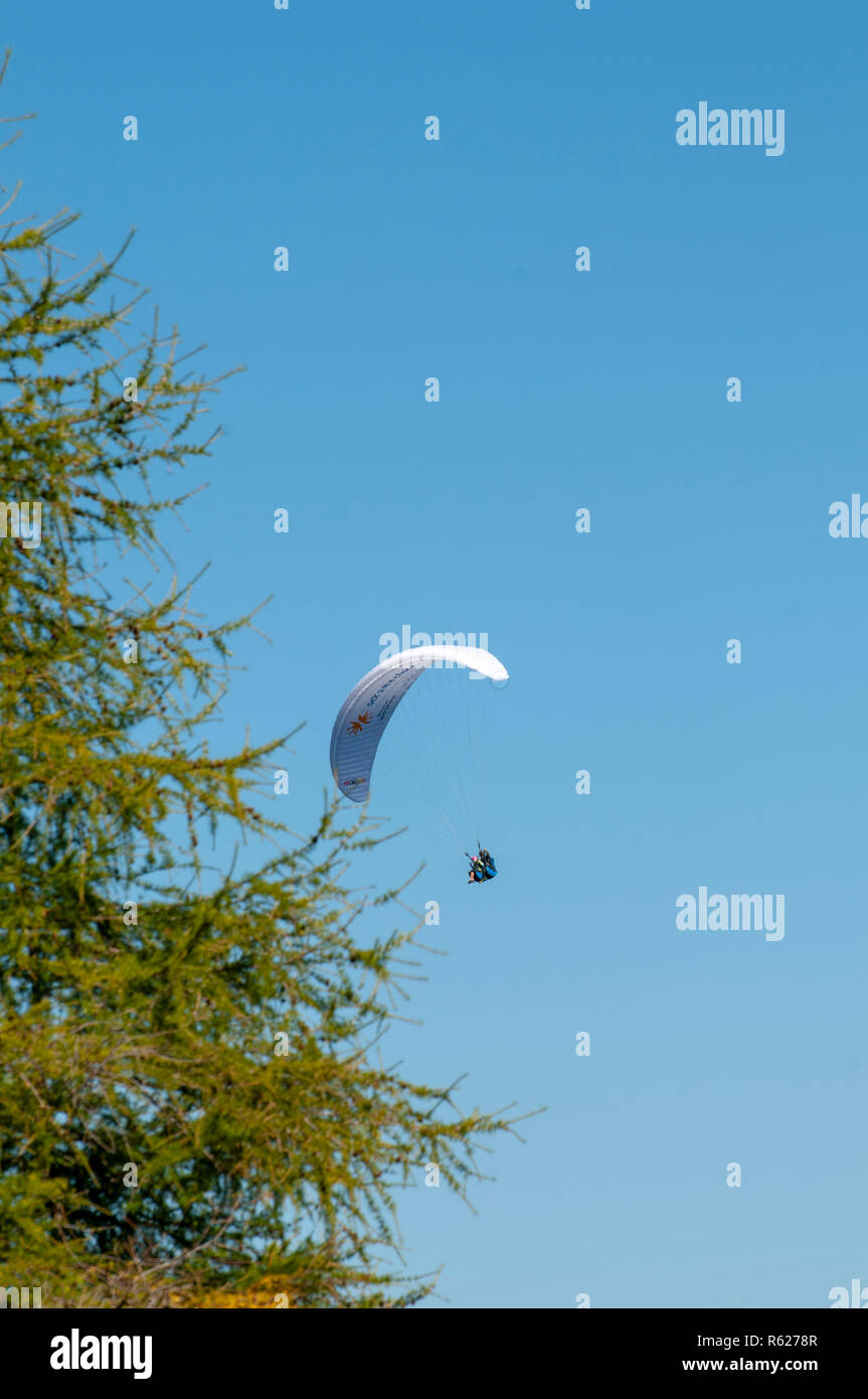 Paragliding with blue sky background from the summit of Elfer mountain ...
