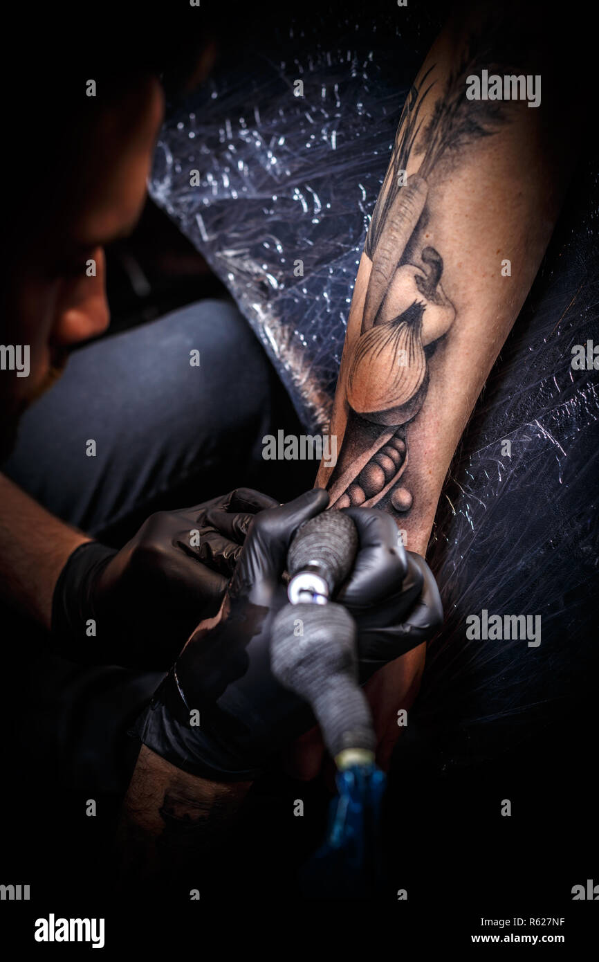 Creating a tattoo Stock Photo - Alamy