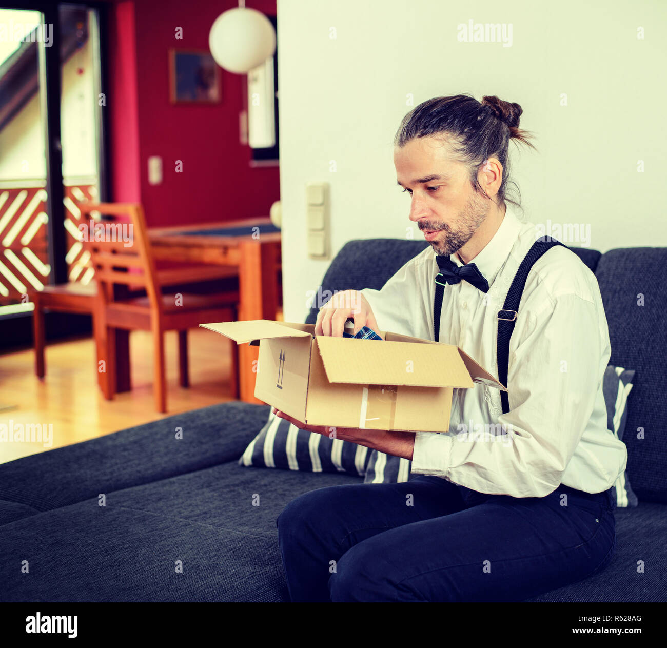 man opening a package Stock Photo - Alamy
