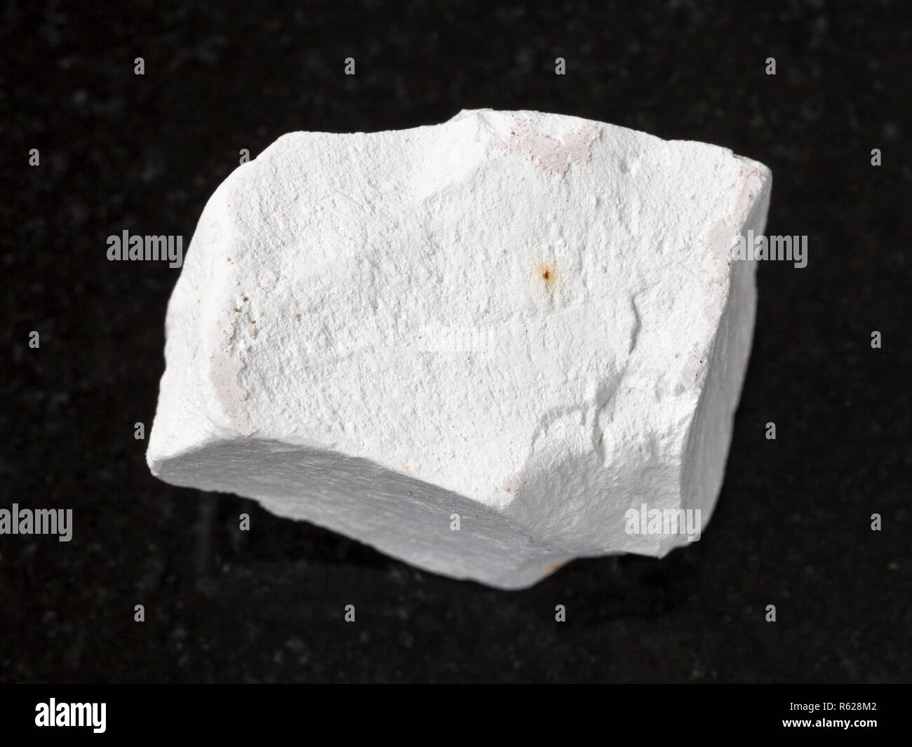 rough chalkstone on dark background Stock Photo - Alamy