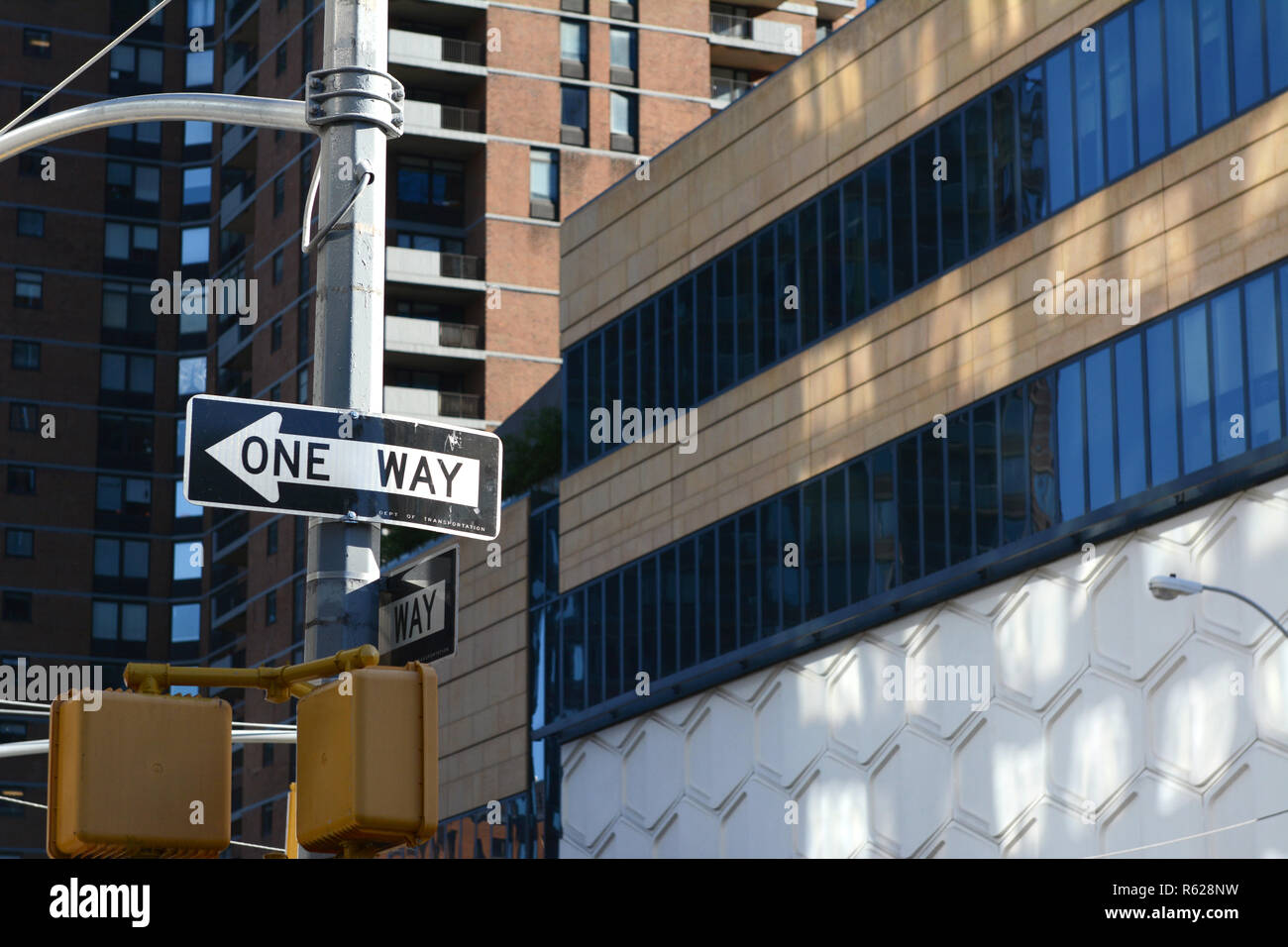 ONE WAY road sign points left on New York street Stock Photo - Alamy