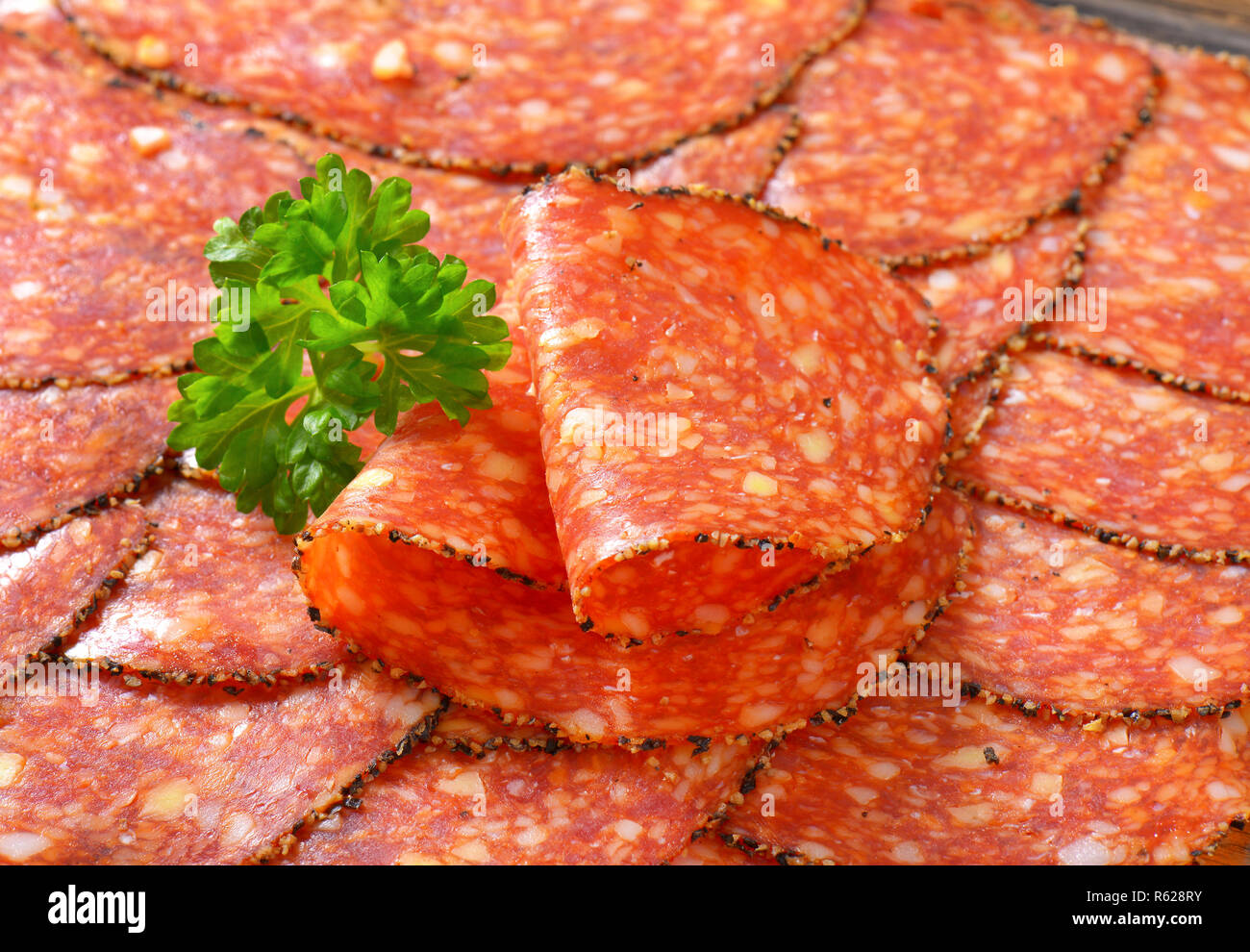 Black pepper-coated salami with cheese Stock Photo - Alamy