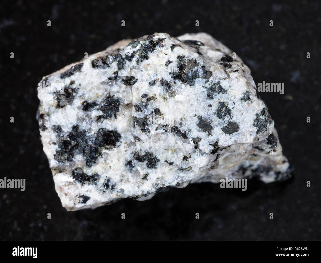 rough white granite stone on dark background Stock Photo - Alamy