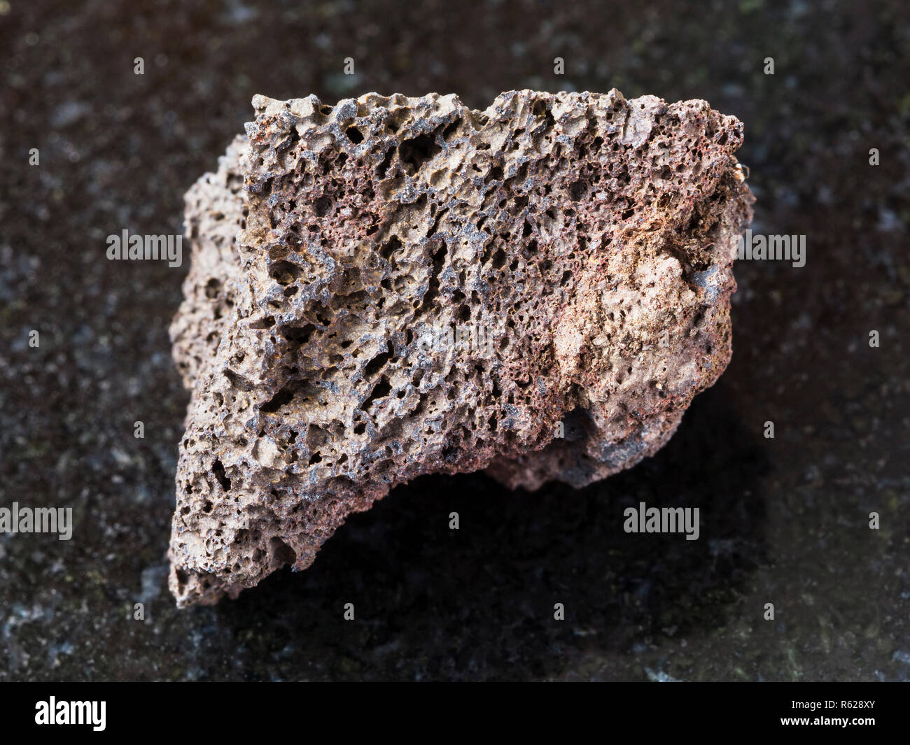 raw Pumice of basic composition stone on dark Stock Photo - Alamy
