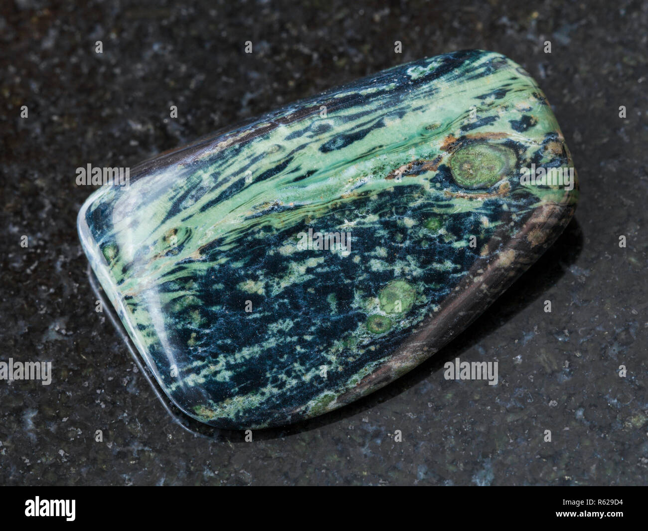 polished rhyolite gemstone on dark background Stock Photo - Alamy