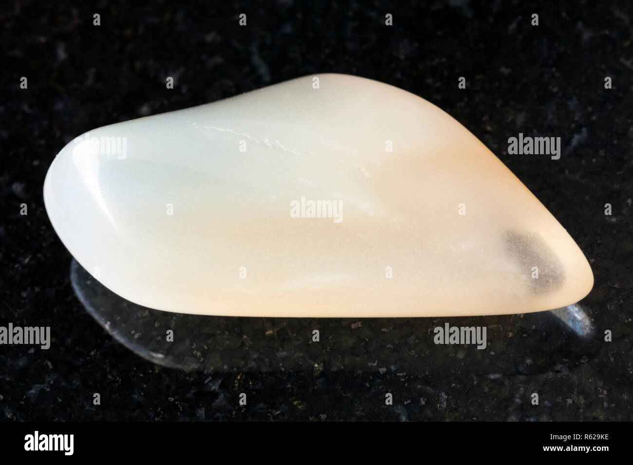 polished yellow moonstone (adularia) gem on dark Stock Photo - Alamy