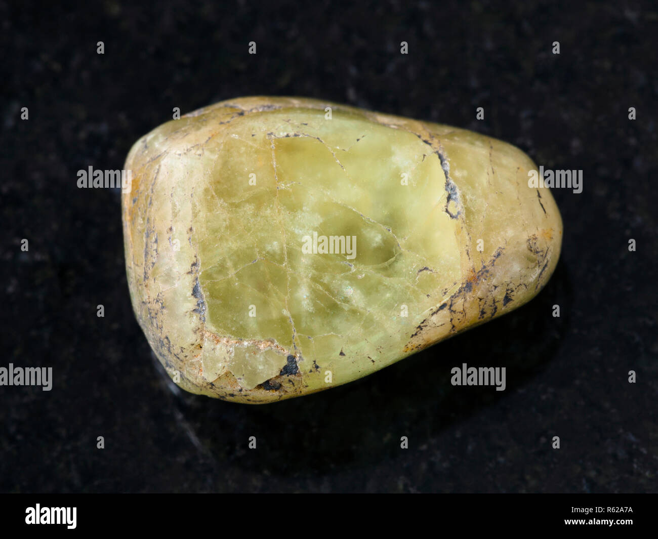 green beryl gem stone on dark background Stock Photo - Alamy